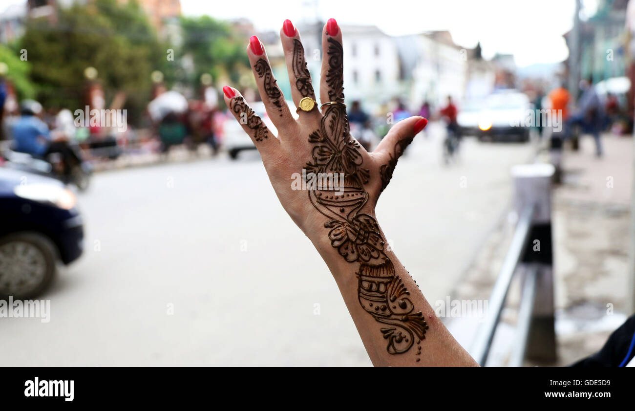 Kathmandu, Nepal. 16th July, 2016. A Nepalese woman shows her hand with ...
