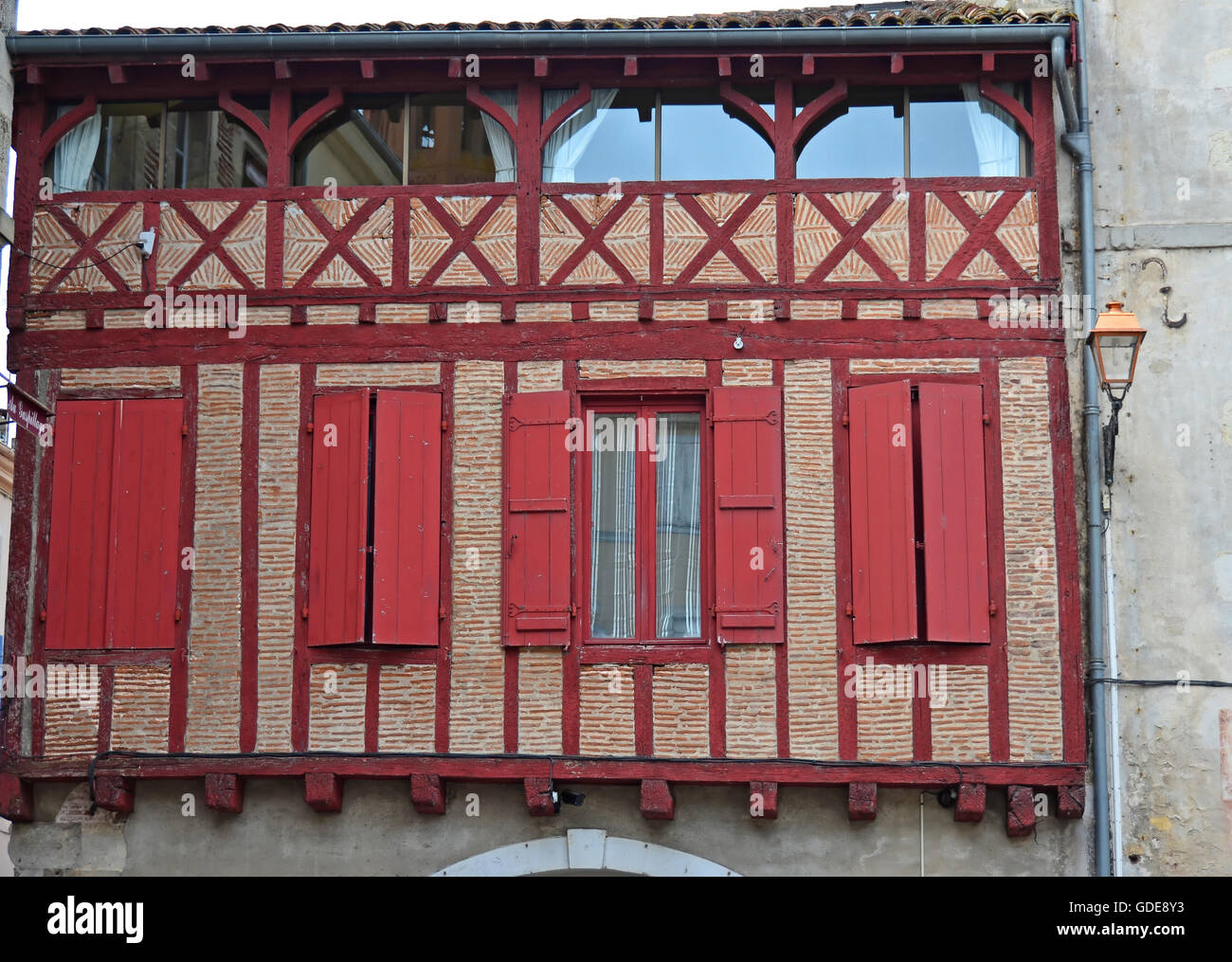 The upper story of a half timbered house on stone basement. Featuring ...