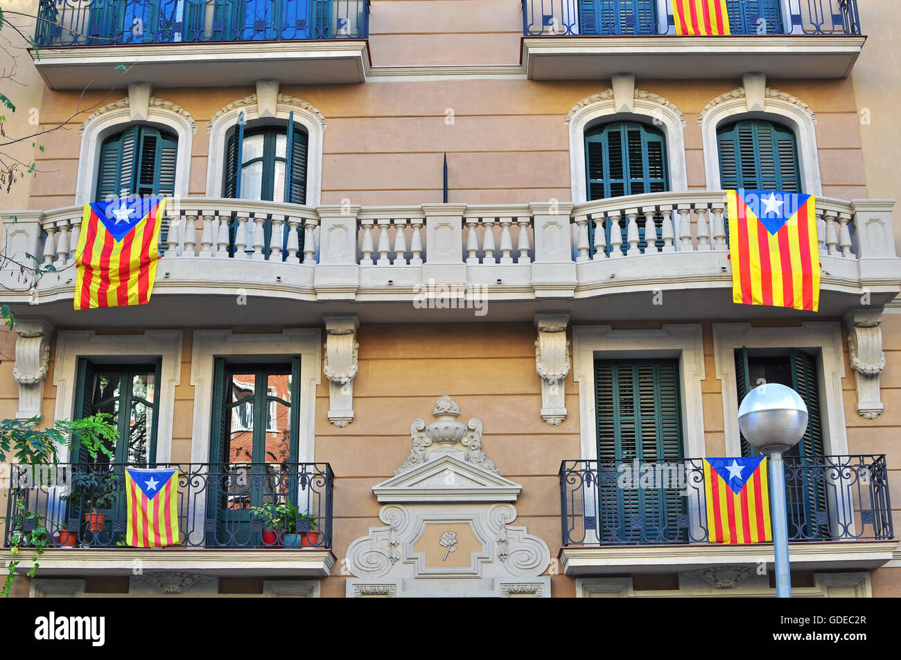 Barcelona house with flags of Catalonia Stock Photo - Alamy