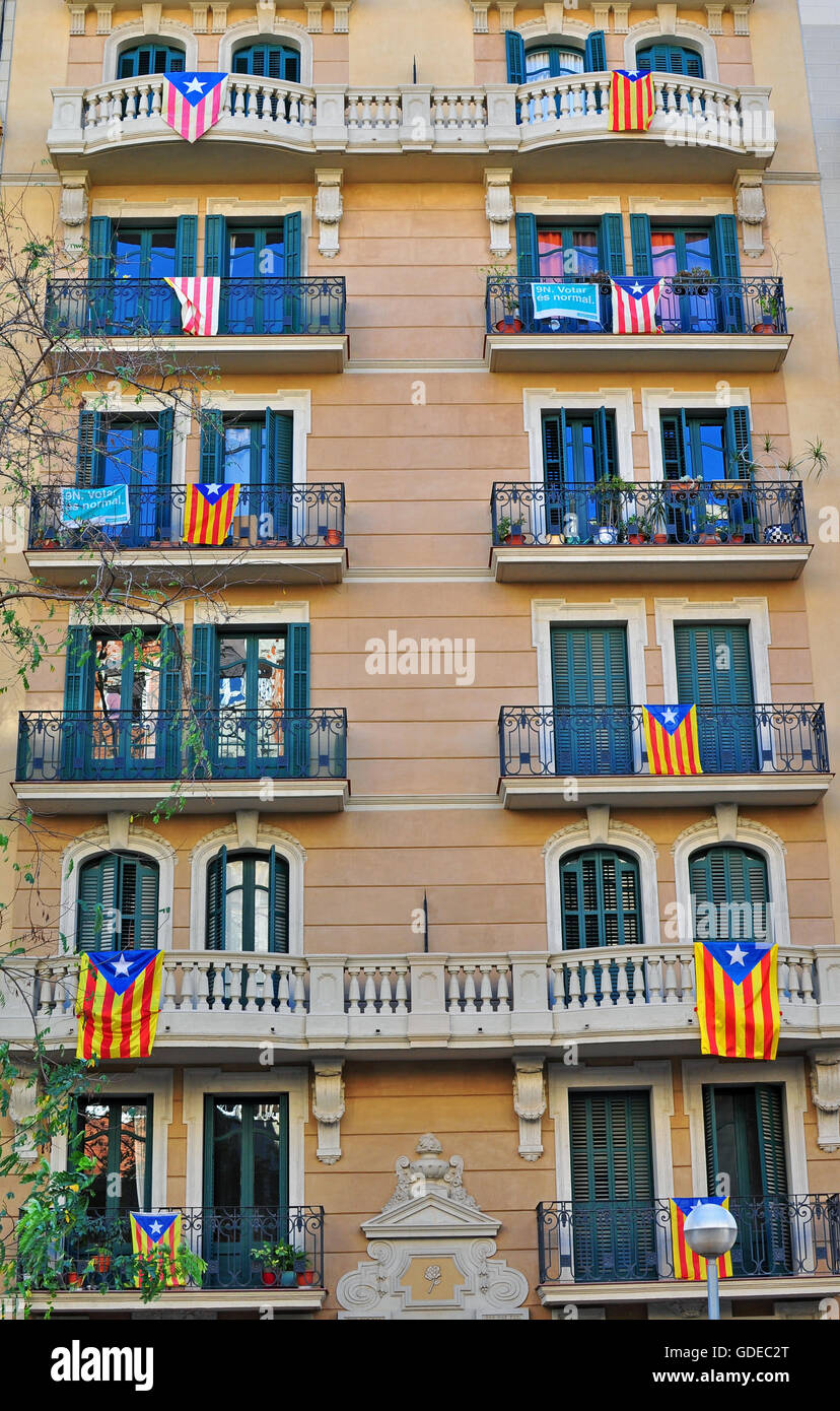BARCELONA, SPAIN - DECEMBER 6: Facade of the house with flags of ...