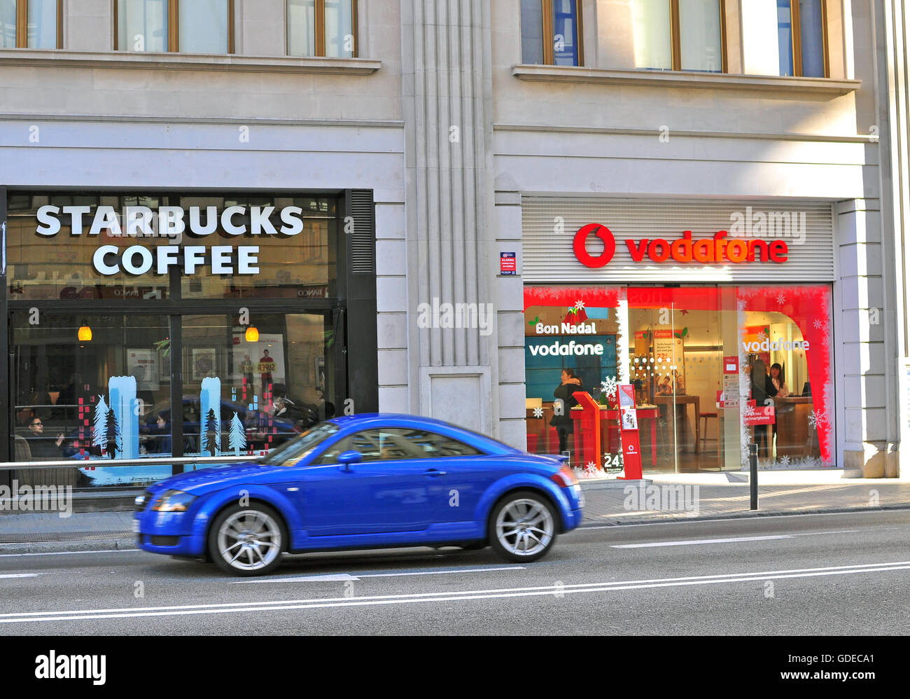 BARCELONA, SPAIN - DECEMBER 30: Car driving in the street of Barcelona ...
