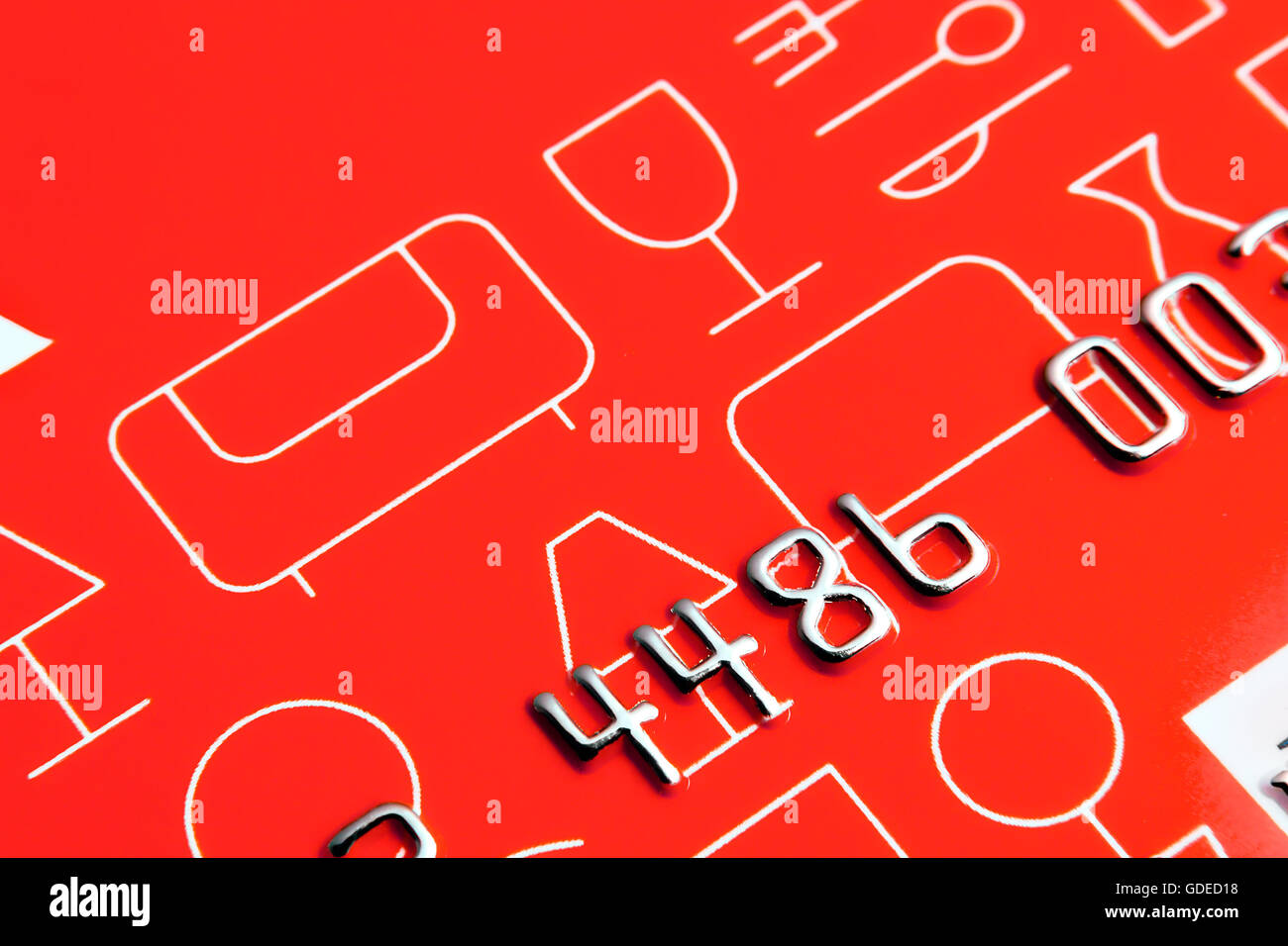 Detail of red credit card with numbers and home-related reasons ...