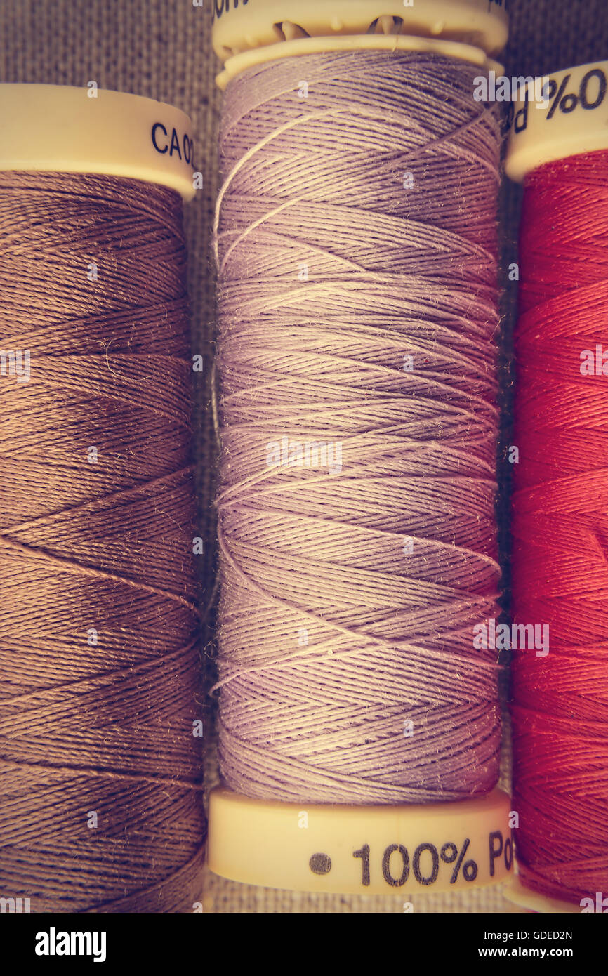 Spools of thread in a retro vintage style. Vertical image Stock Photo ...