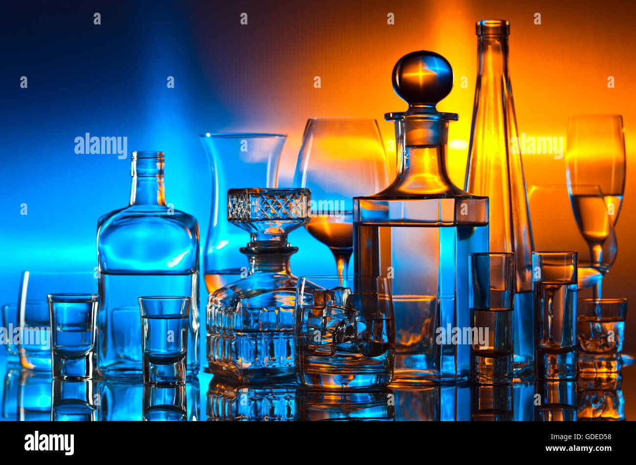 alcoholic drinks in bar on glass table Stock Photo - Alamy