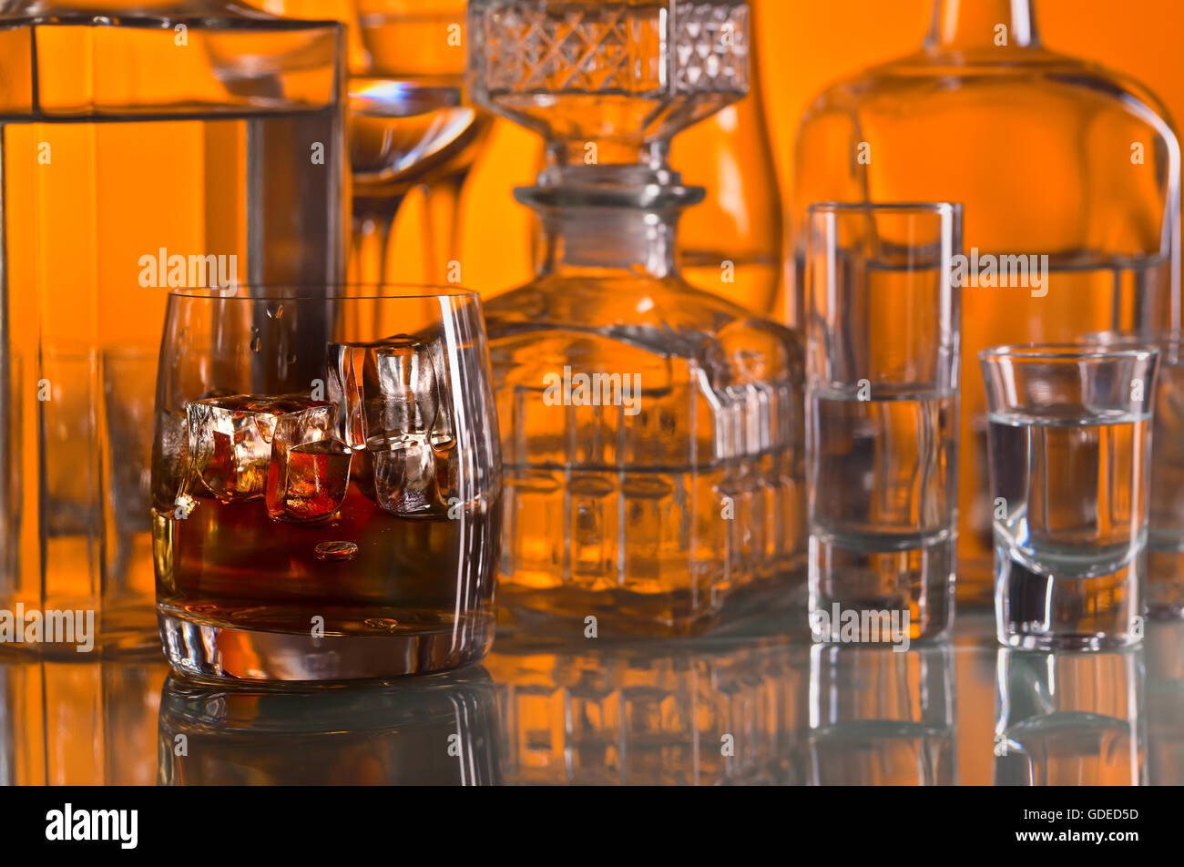 alcoholic drinks in bar on glass table Stock Photo - Alamy