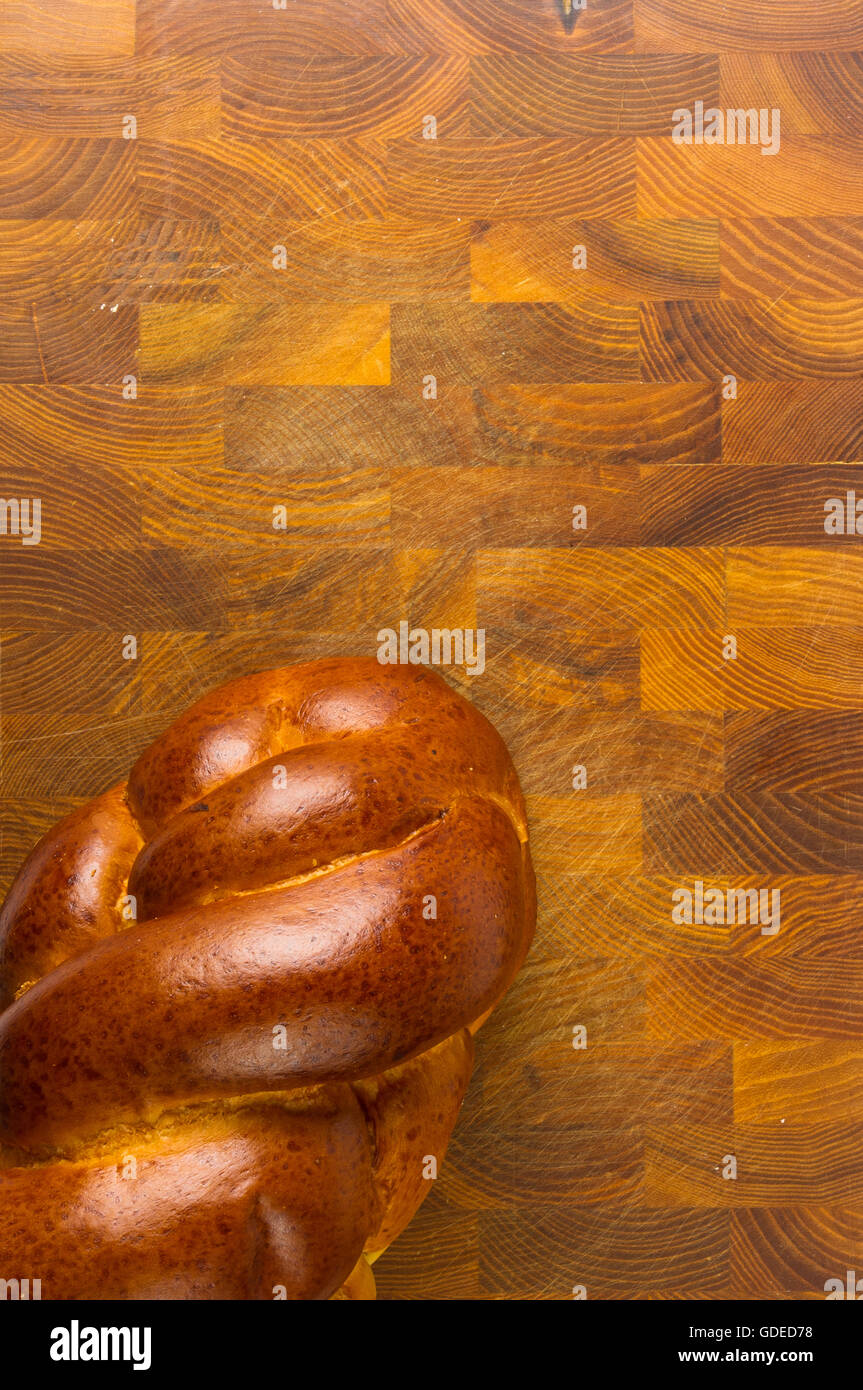 chunks large braided loaf on wooden background Stock Photo - Alamy
