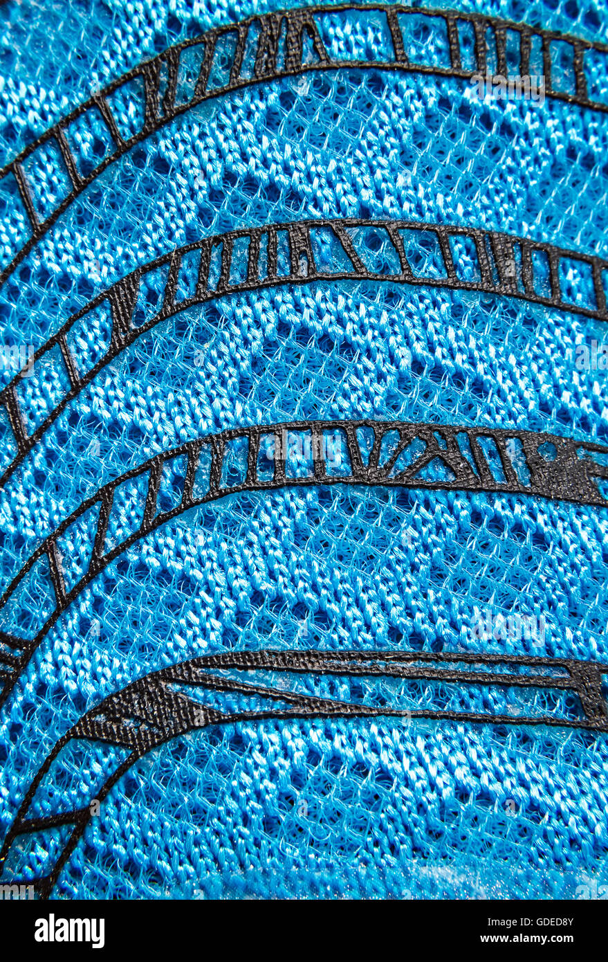 Sneakers. Closeup detail of a portion of the shoe with black stripes ...