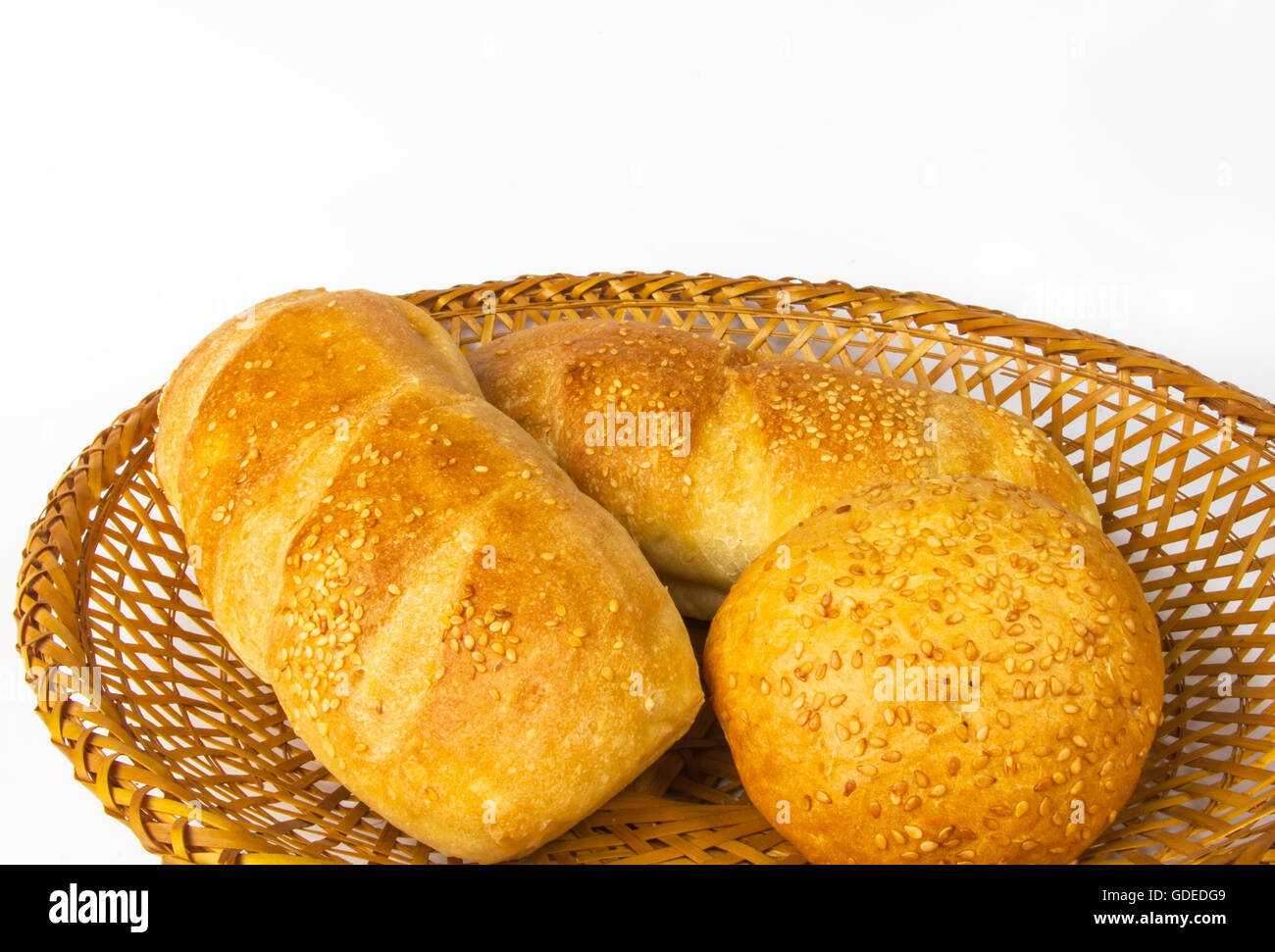 whole wheat two breads and bun on a wicker plate Stock Photo - Alamy