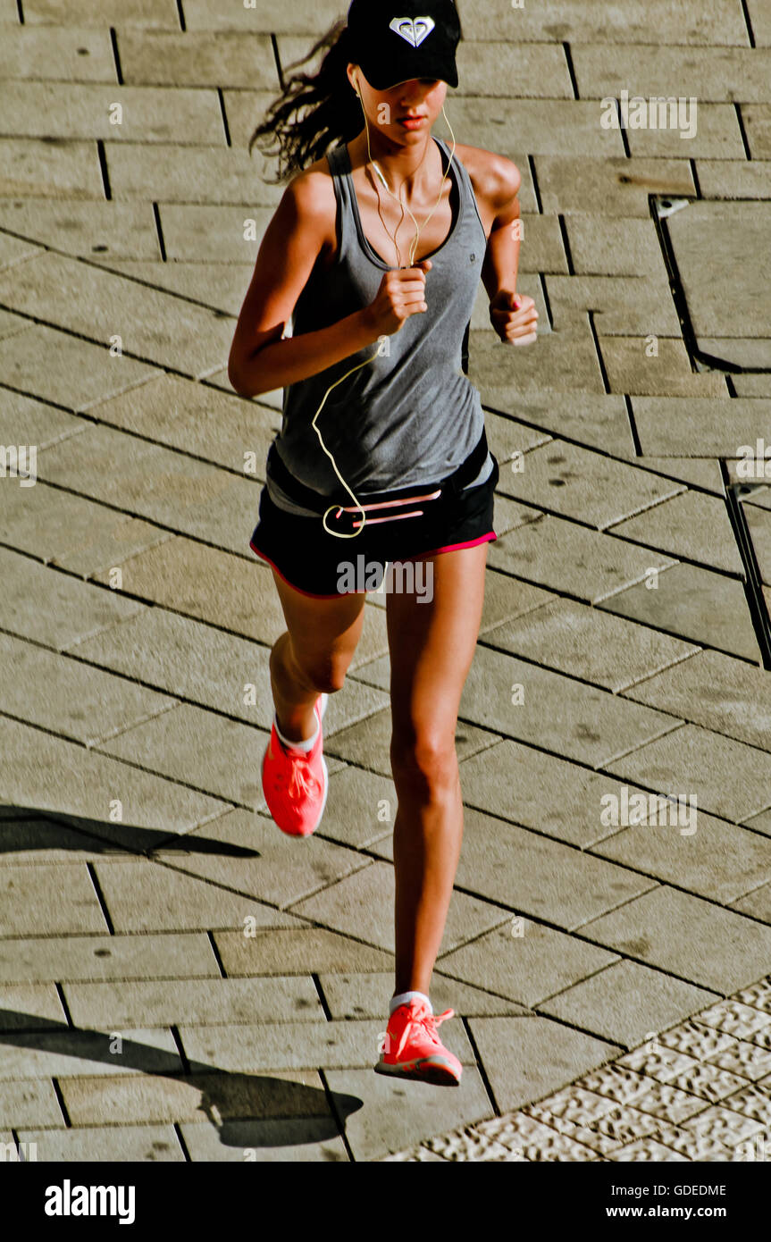 young woman running Stock Photo - Alamy