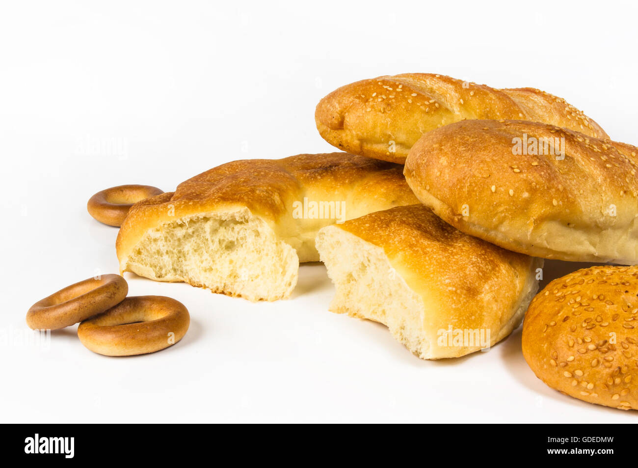 whole wheat two breads, unleavened wheat cake and bun on white ...