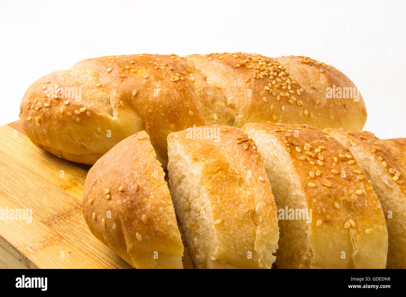 whole wheat breads on a chopping Board Stock Photo - Alamy