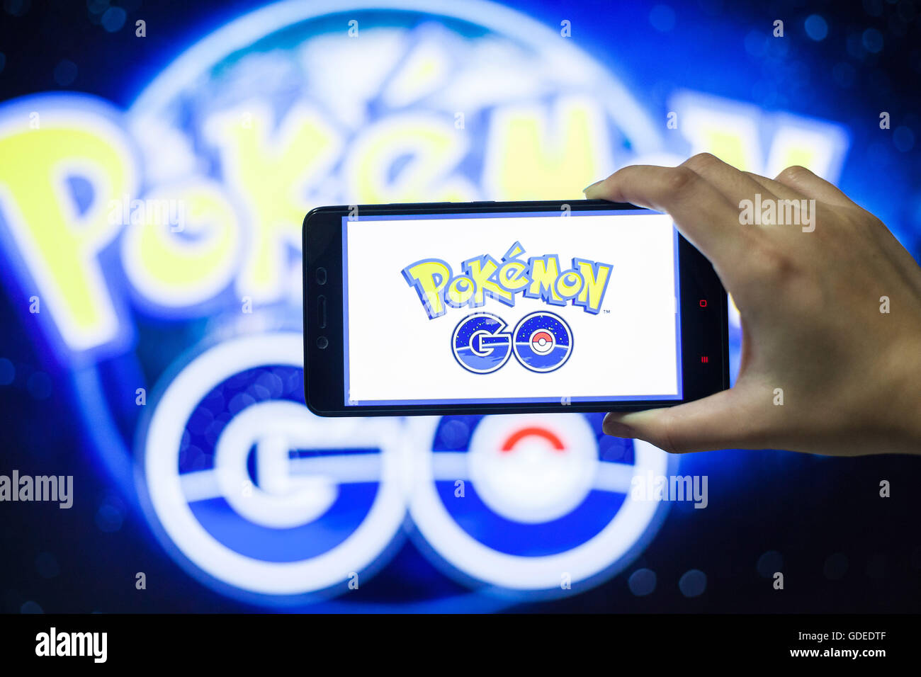 Pokemon Go game while with blur background Stock Photo - Alamy