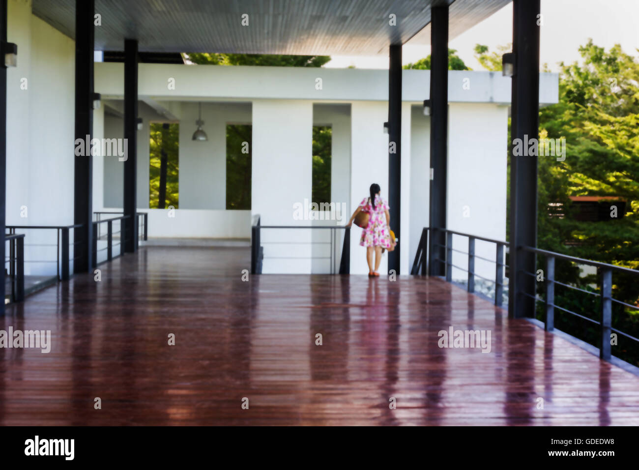 Blurred background wooden floor in airly or open lobby in modern ...