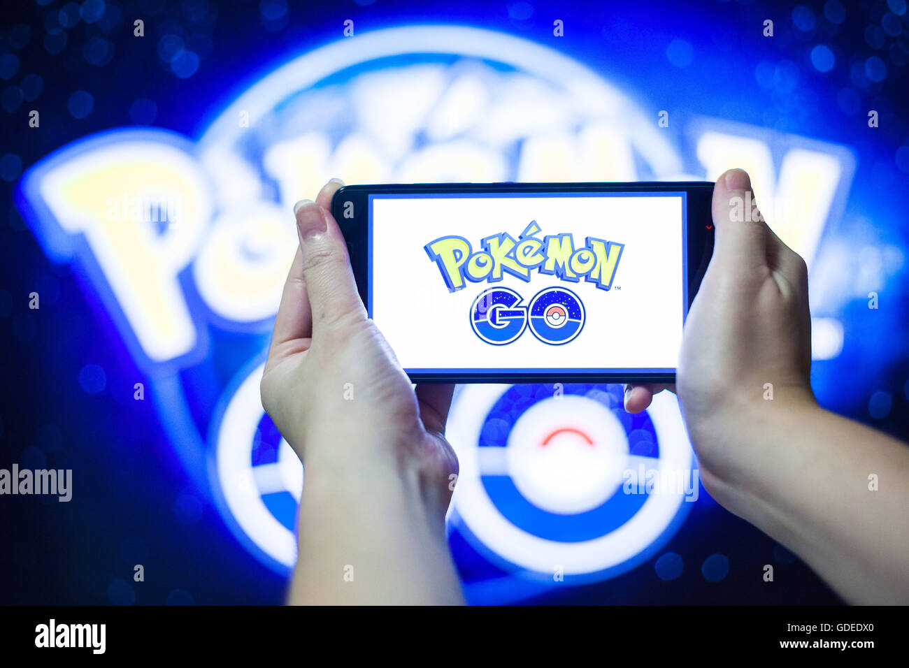 Pokemon Go game while with blur background Stock Photo - Alamy
