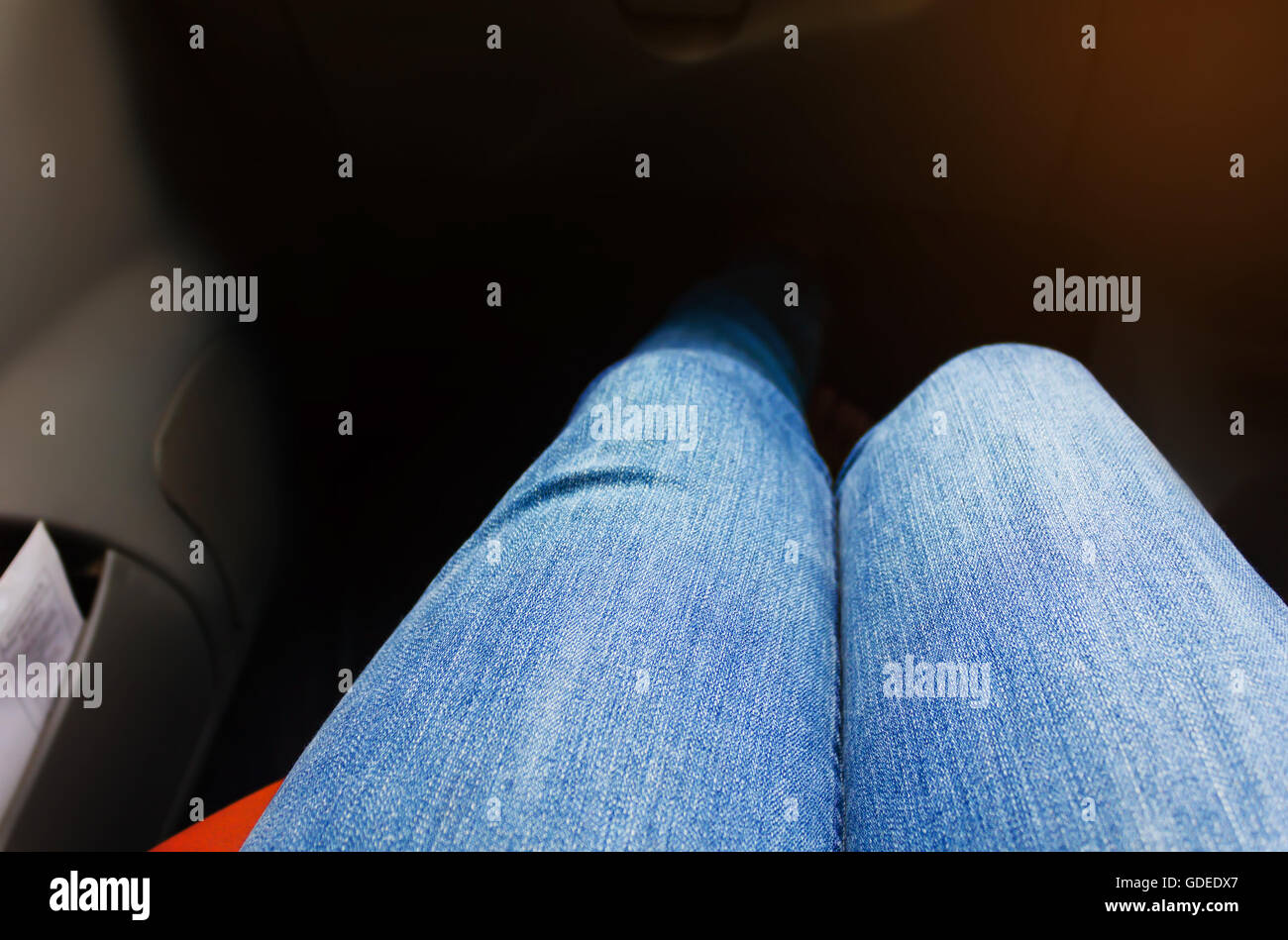 Legs in denim blue jeans, wearing jeans in simply day on car,women or ...