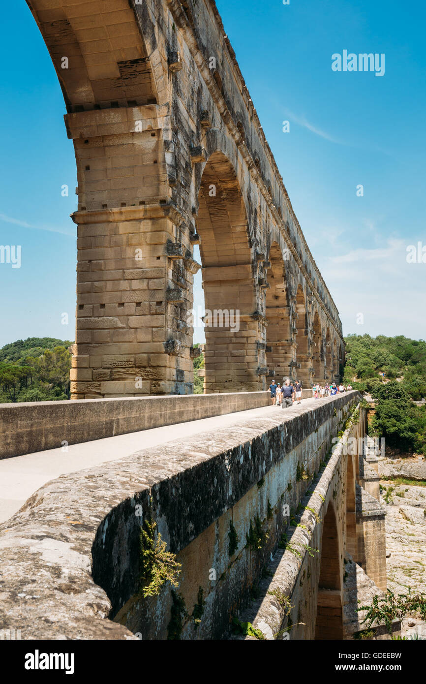 Nimes, France - June 27, 2015: People walking near famous landmark ...