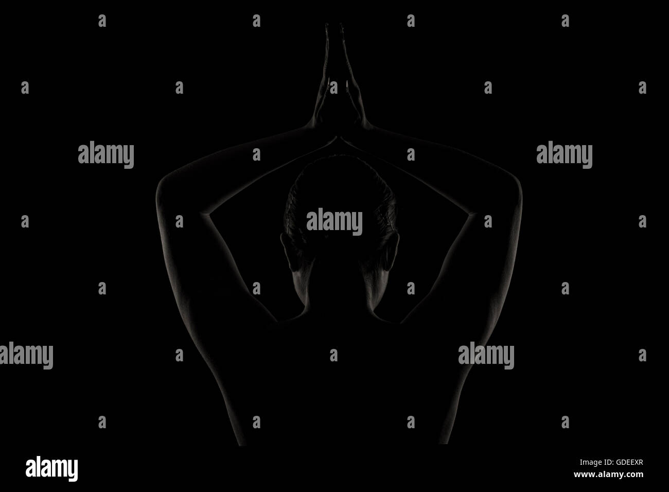 The shape of woman's back in black lights with black background Stock ...