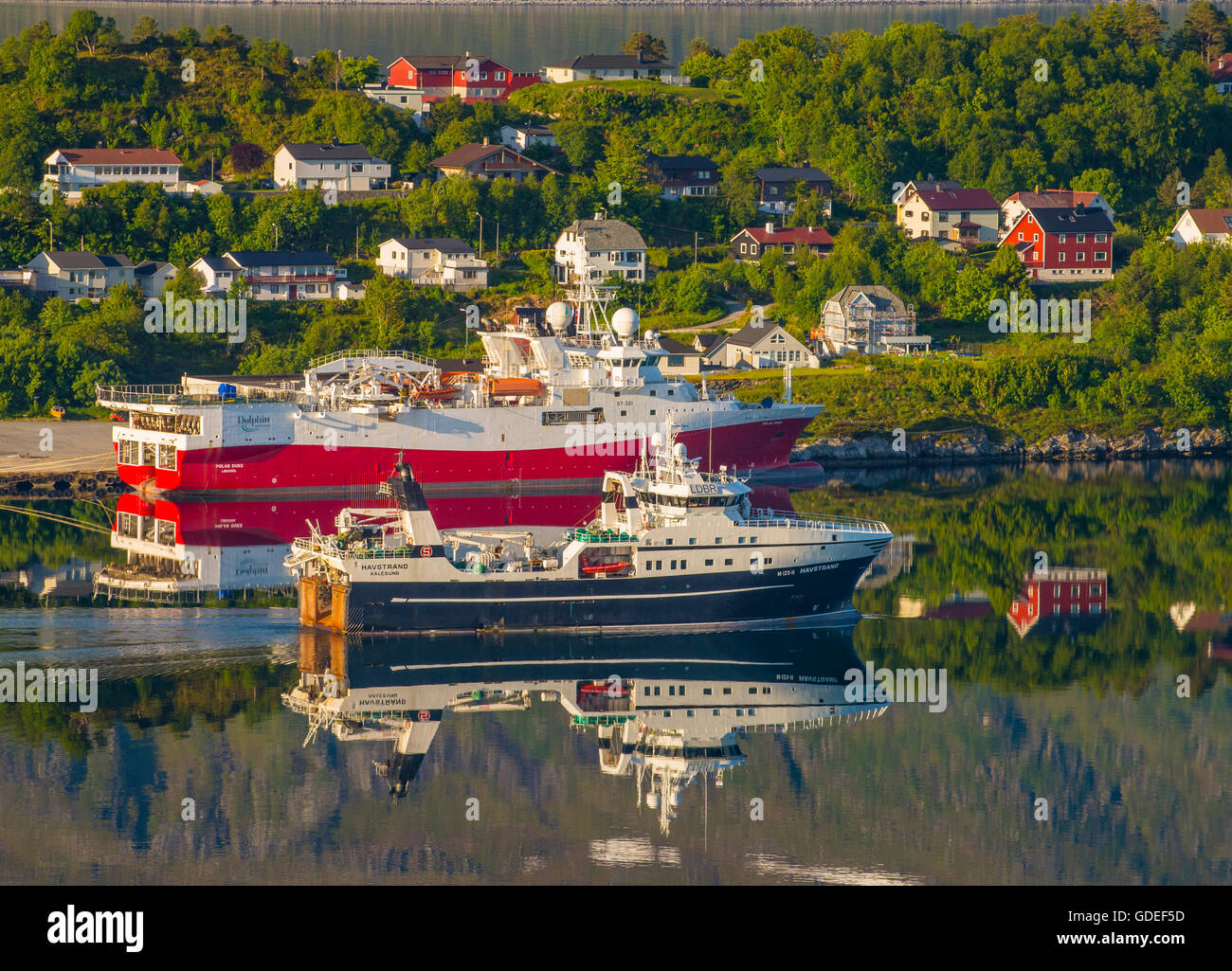 View of Colorful Fishing Trawlers anchored in Outer Fjord, Alesund ...