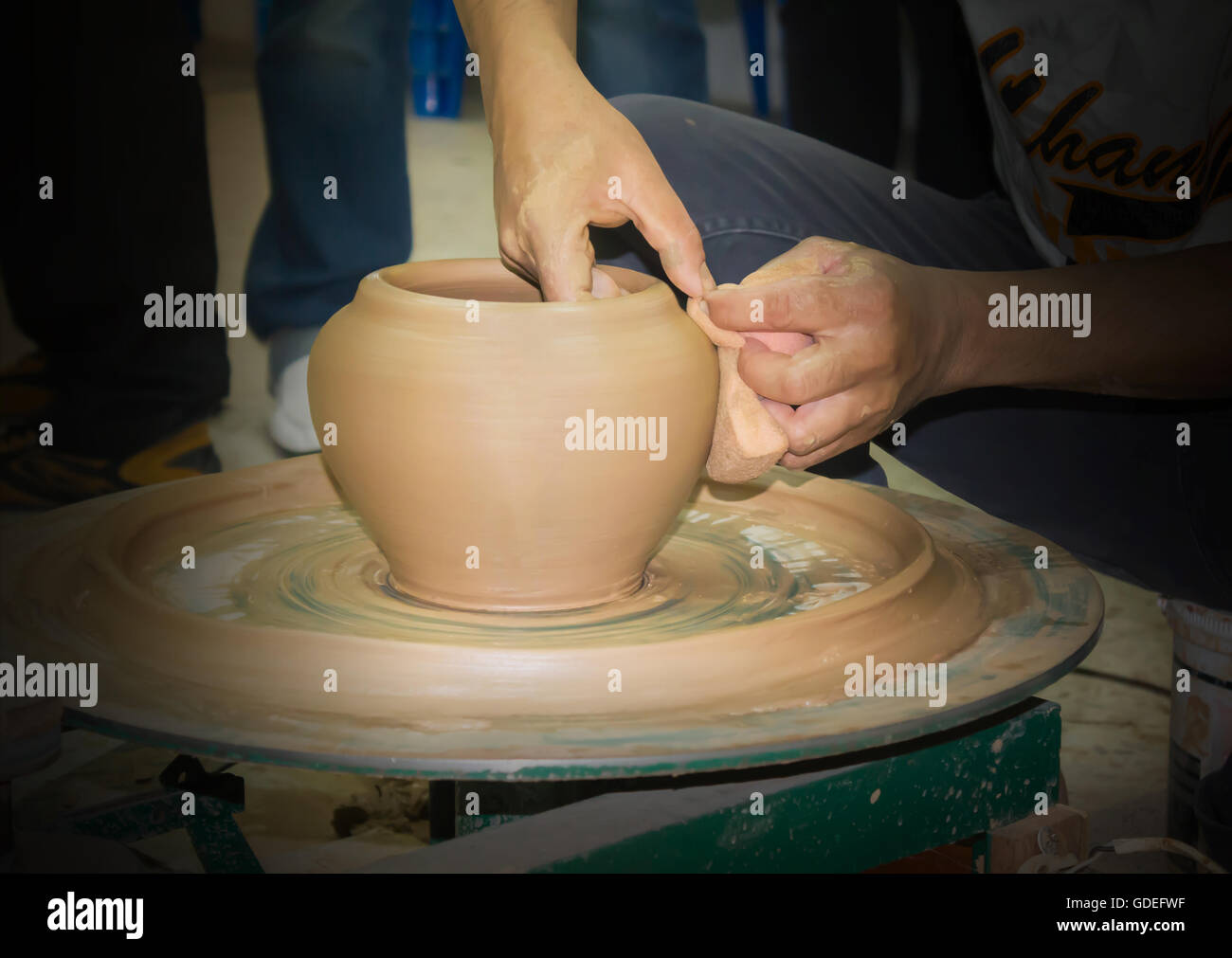Pottery clay vase being formed and modeller hands Stock Photo - Alamy