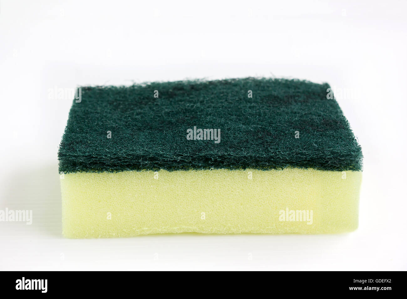 Closeup scrub sponge or disk sponge on white background Stock Photo - Alamy