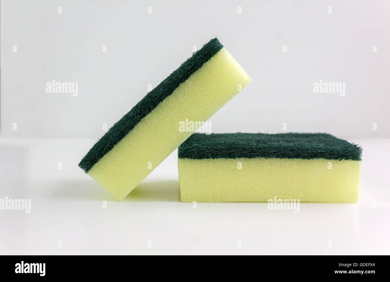Closeup scrub sponge or disk sponge on white background Stock Photo - Alamy