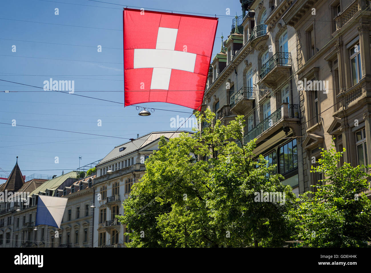 Swiss flag flying in streets of zurich hi-res stock photography and ...