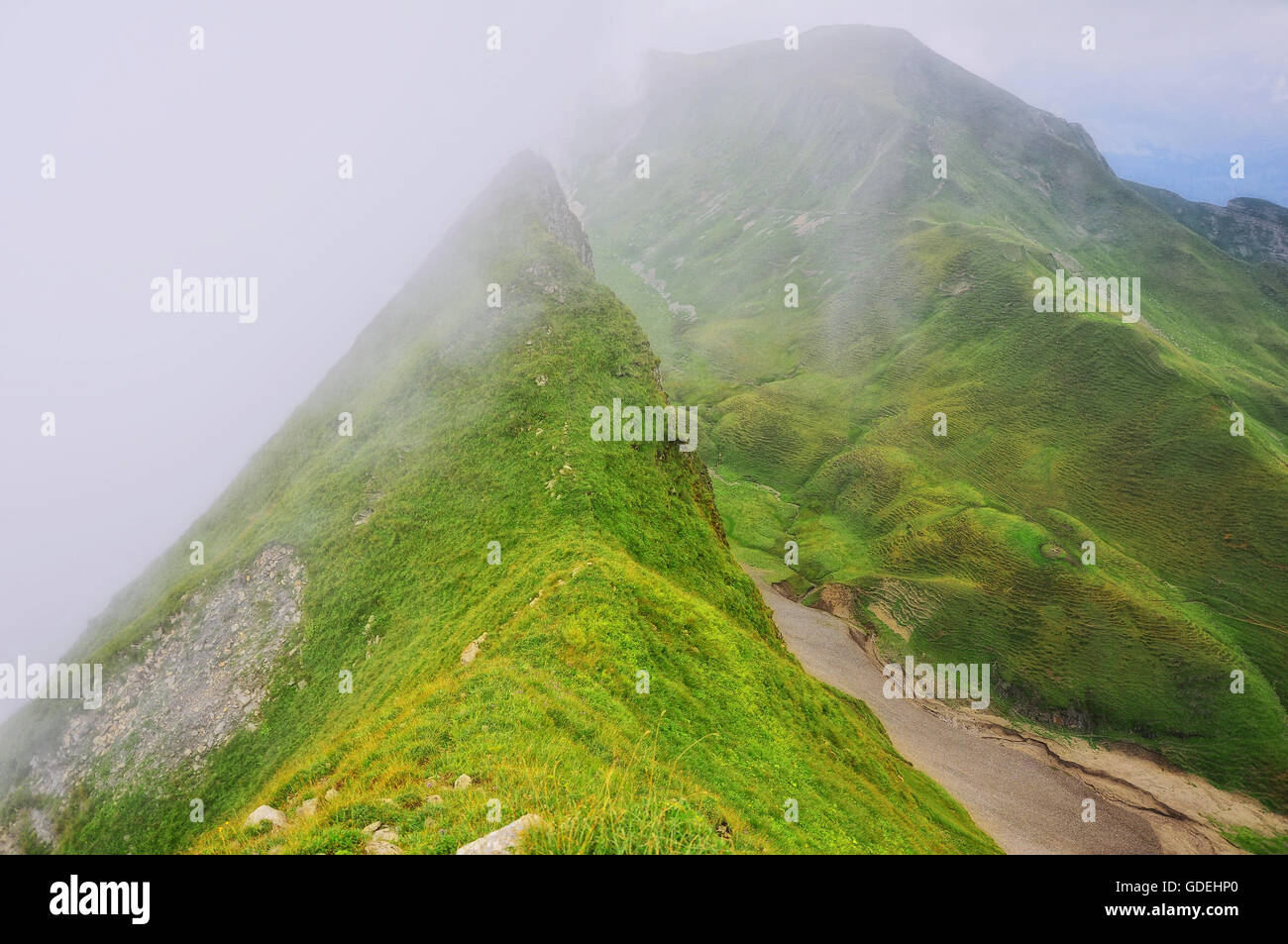 Santis Mountain peak covered in mist, Switzerland Stock Photo - Alamy