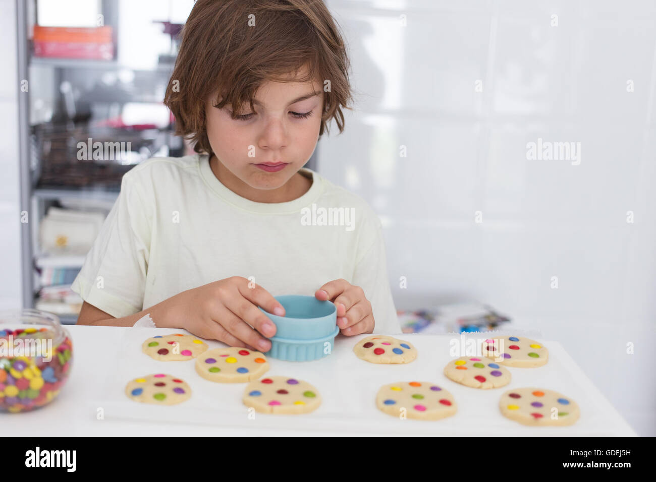 Boy making cookies Stock Photo - Alamy
