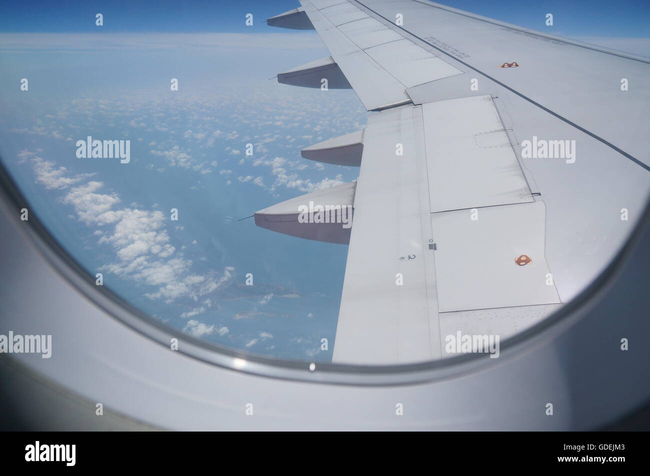 Airplane wing seen through window Stock Photo - Alamy