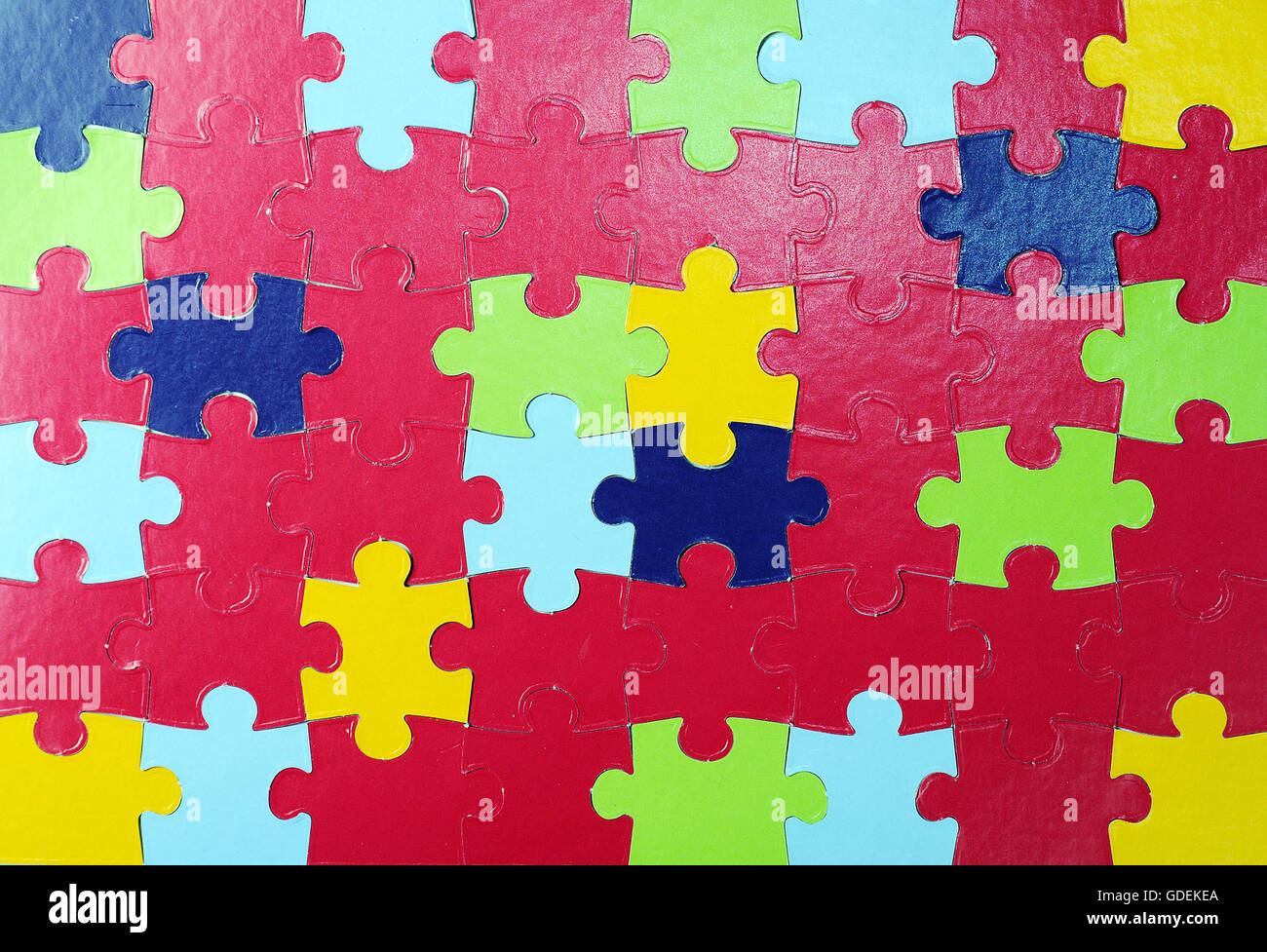Many colored puzzle shiny pieces pattern photo Stock Photo - Alamy