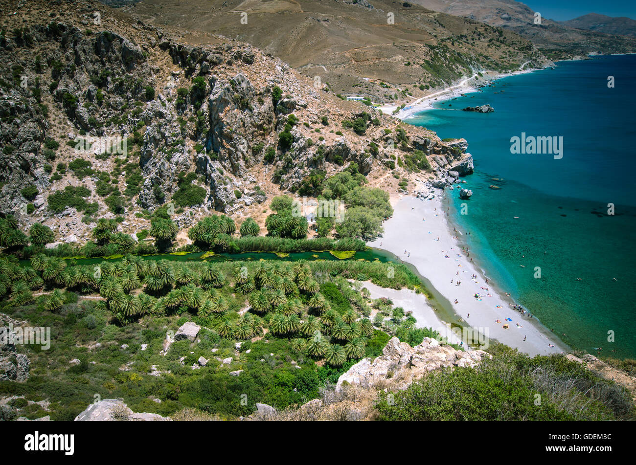 Preveli Beach in Crete island, Greece. There is a palm forest and a ...