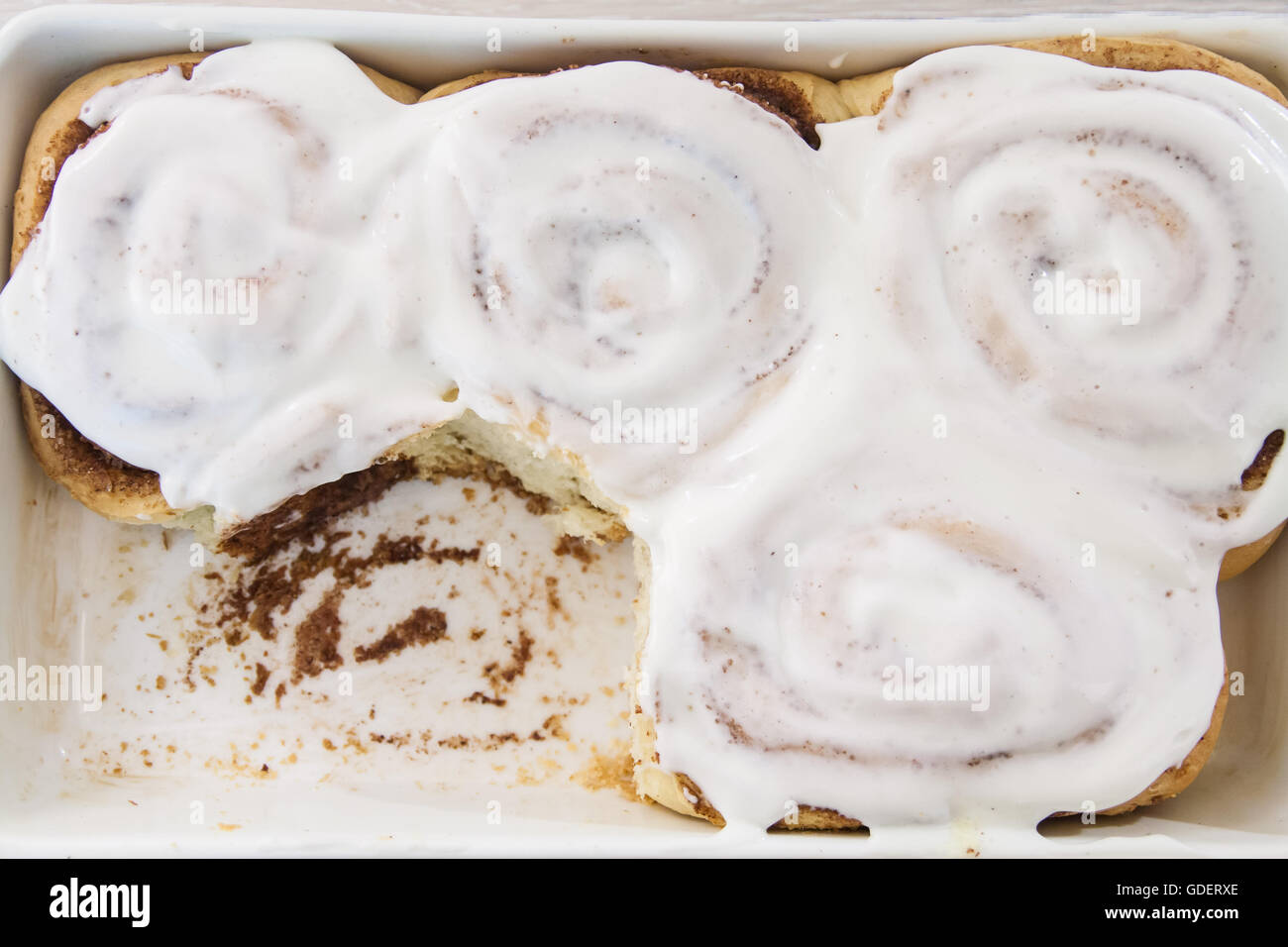 Buns, rolls with icing on the grid Stock Photo - Alamy