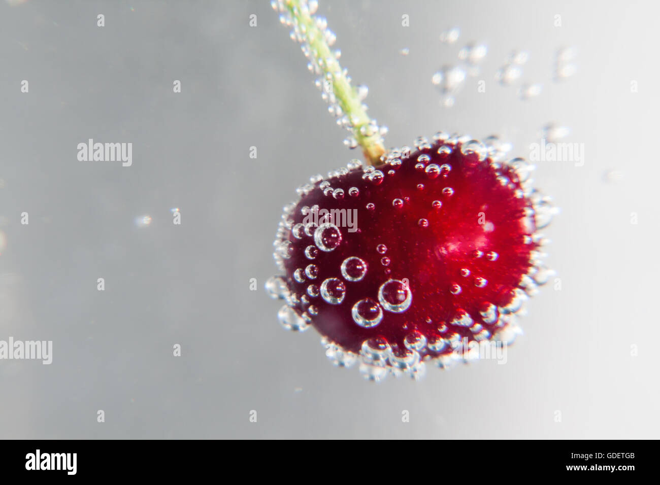 Cherry splash in transparent water hi-res stock photography and images ...