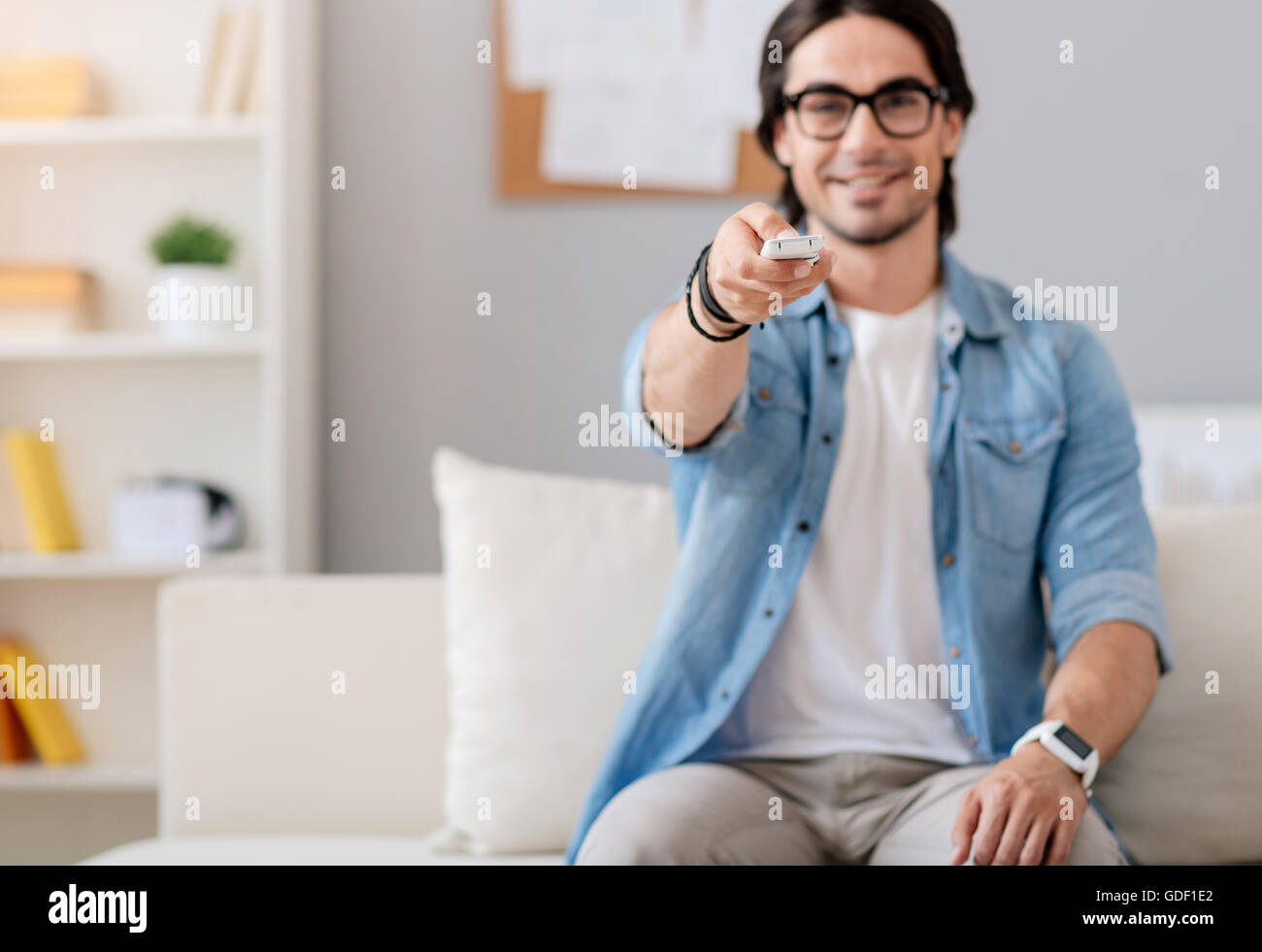 Positive handsome man watching TV Stock Photo - Alamy