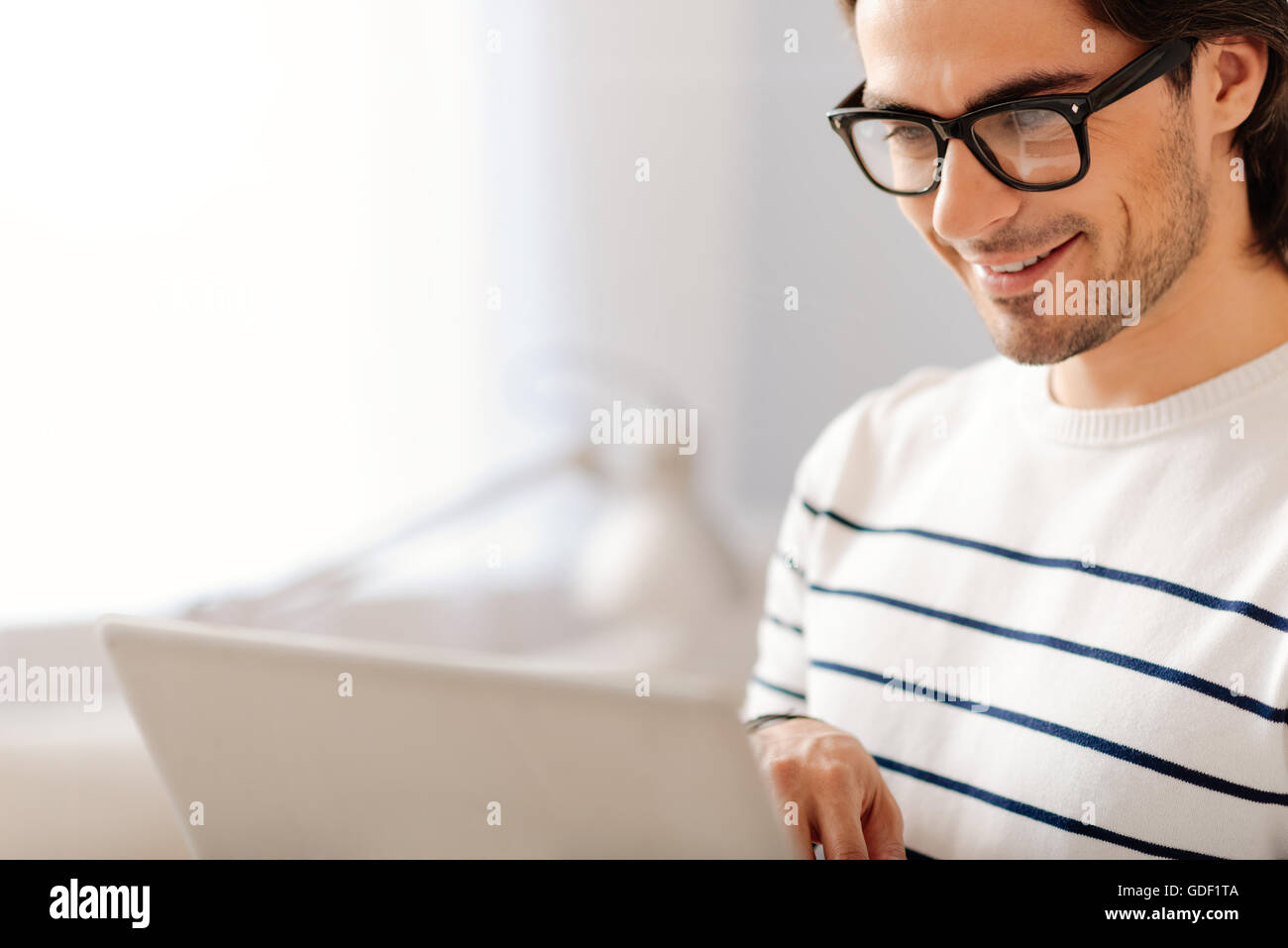 Handsome pleasant man using hi-res stock photography and images - Alamy