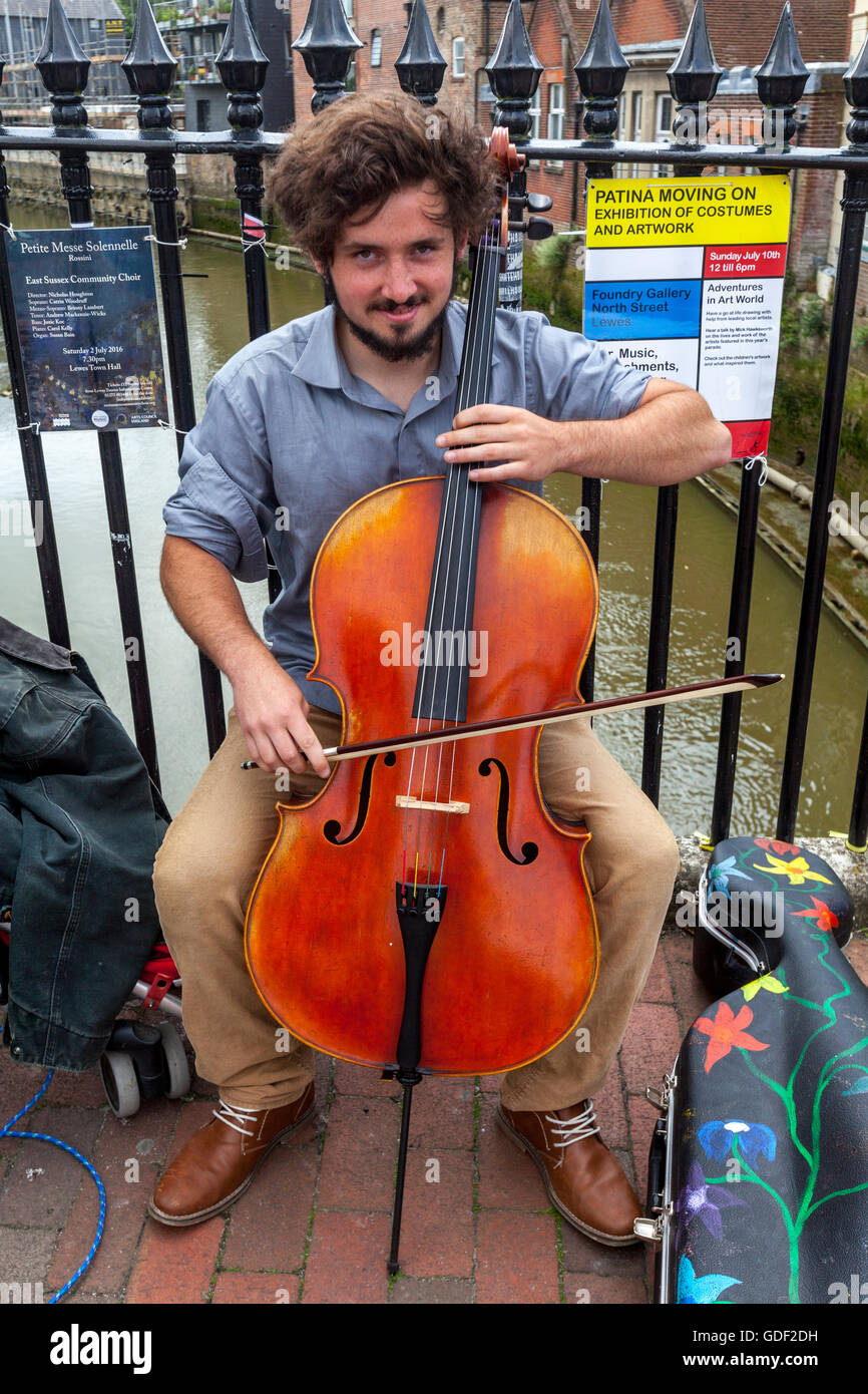 Young street musician playing cello hi-res stock photography and images ...