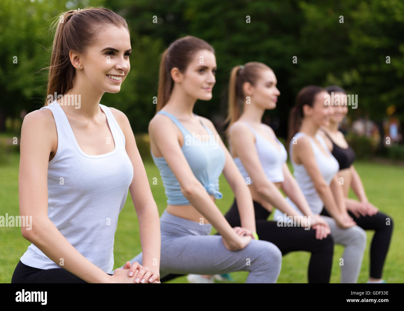Positive women doing sport exercises Stock Photo - Alamy