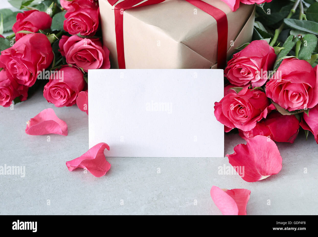 Roses and gift Stock Photo - Alamy
