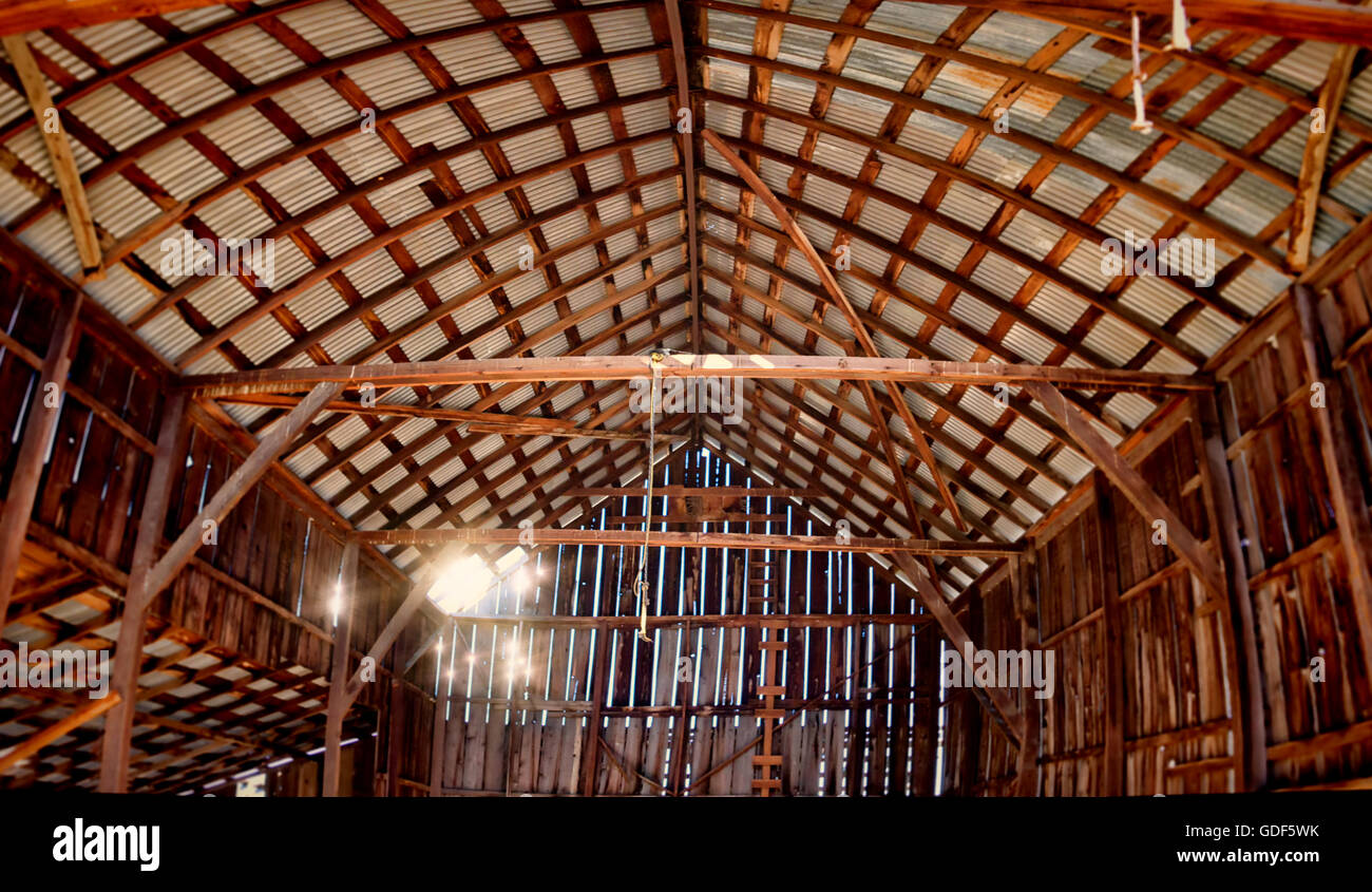 An old barn interior with sunlight coming through the boards Stock ...