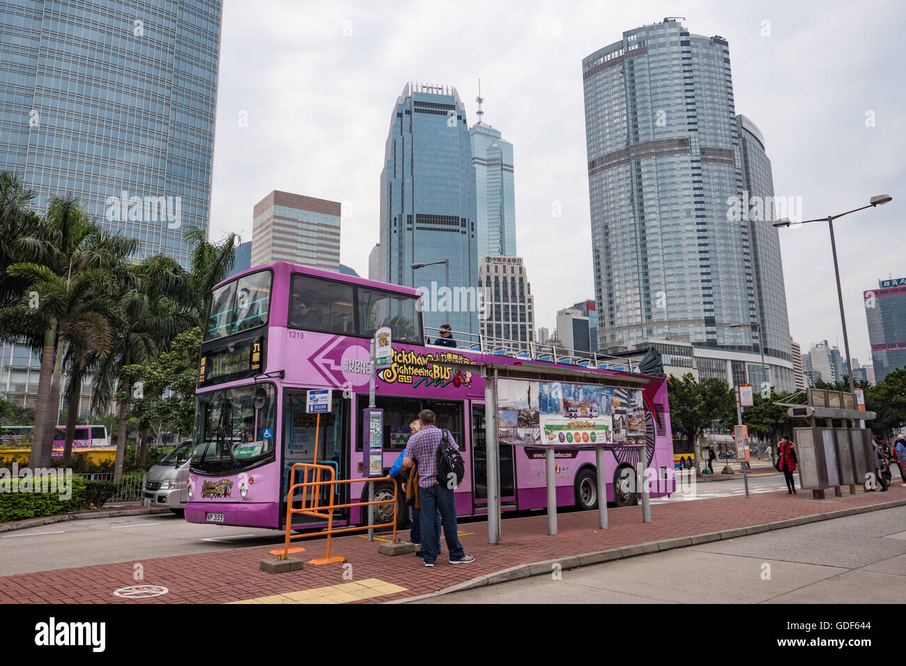 Open topped tour bus near Central Pier and Finance quarter in Hong Kong ...