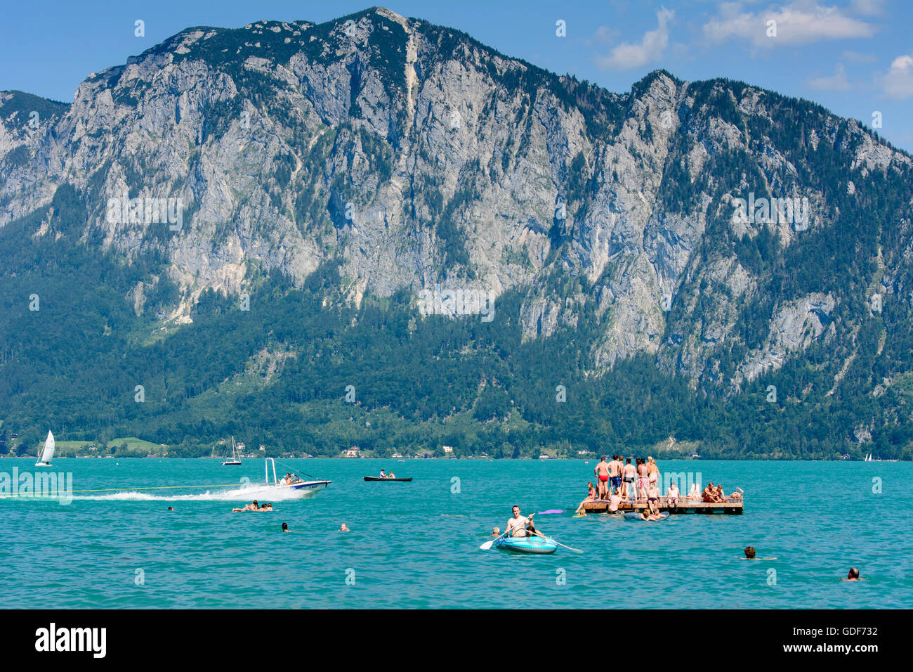 Unterach am Attersee: lake Attersee with bathing raft , bathers , motor ...