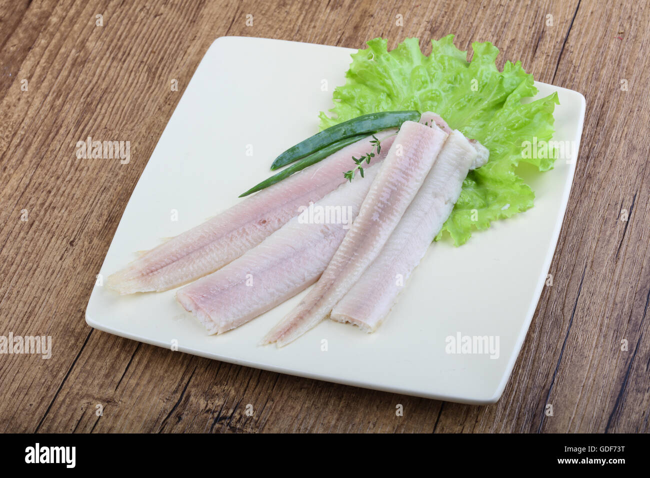 Eel fillet smoked with onion and salad leves Stock Photo - Alamy