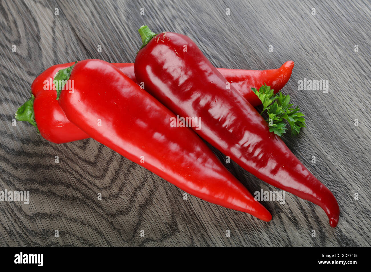 Fresh ripe Ramiro pepper on wood background Stock Photo - Alamy