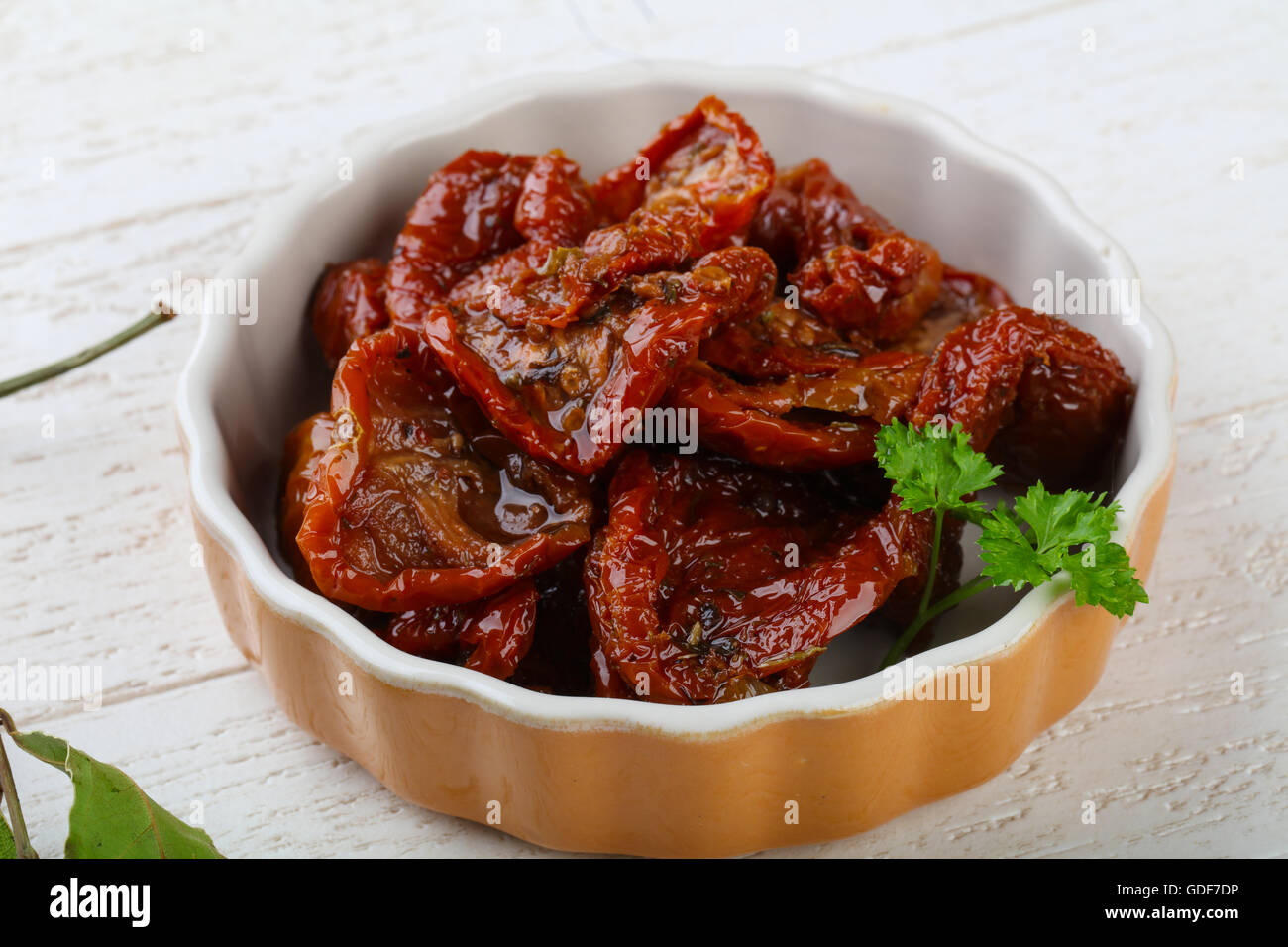 Dry tomato in olive oil with pepper Stock Photo - Alamy