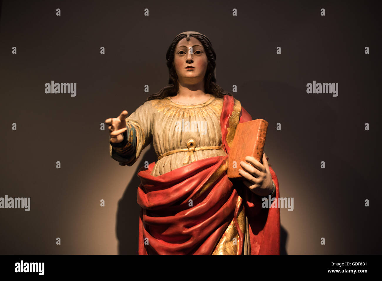 A guilded wood statue of Saint Catherine (Santa Catarina) by a ...