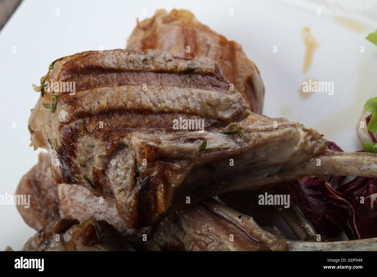 Lamb Frenched Rack grilled rib bone Stock Photo - Alamy