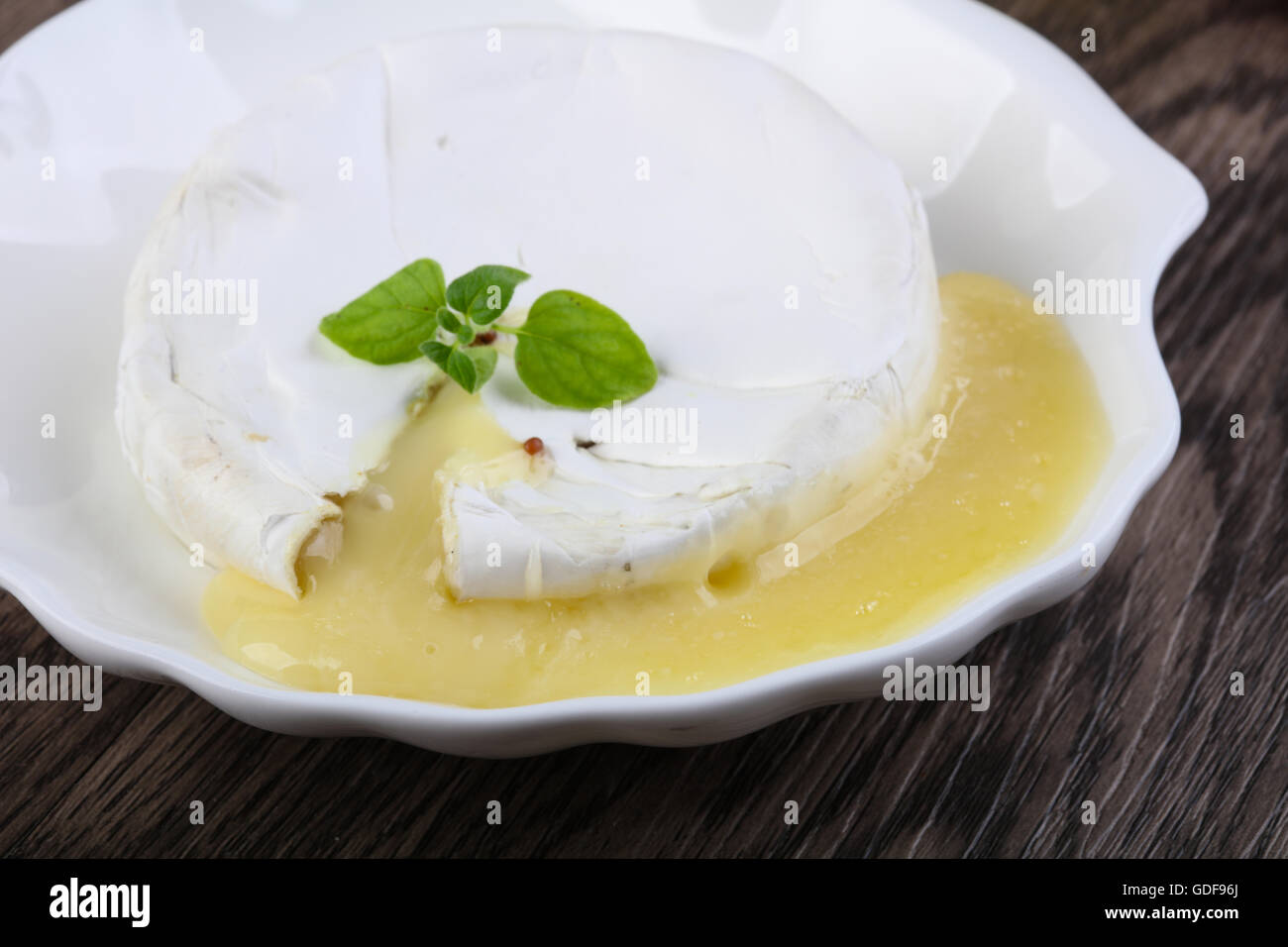 Baked brie cheese on the wood background Stock Photo - Alamy