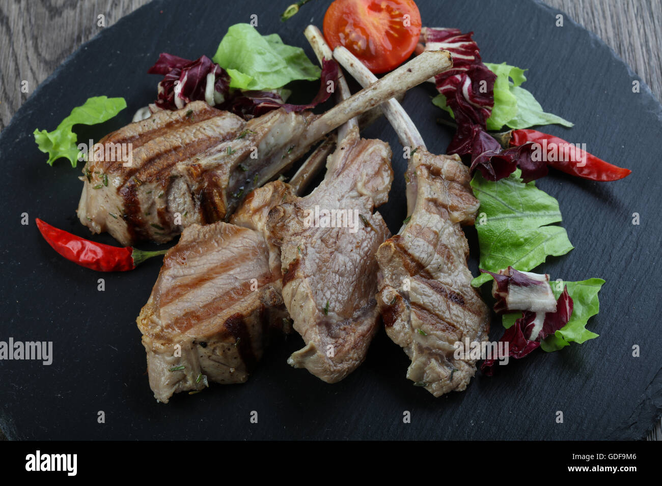 Lamb Frenched Rack grilled rib bone Stock Photo - Alamy