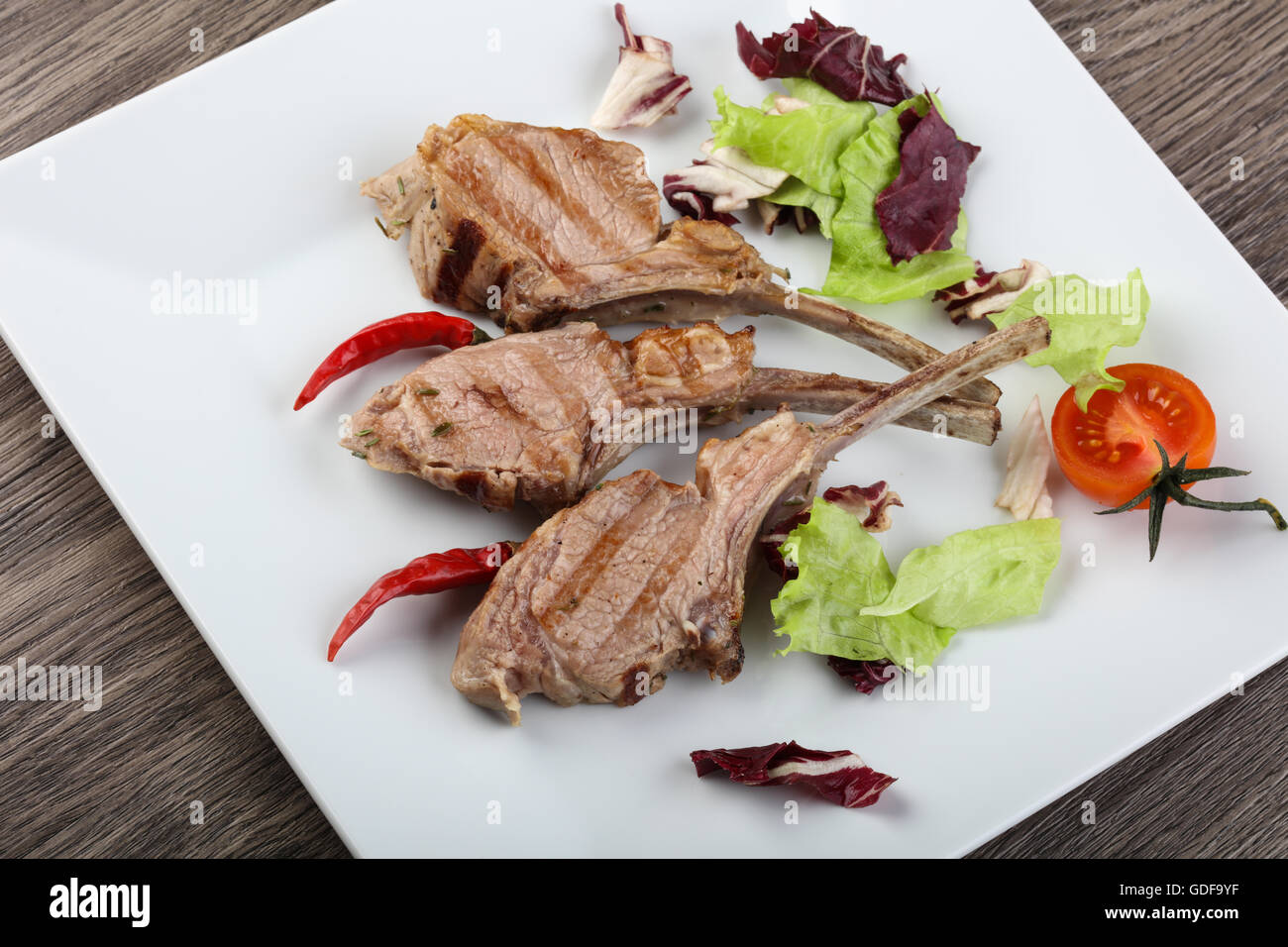 Lamb Frenched Rack grilled rib bone Stock Photo - Alamy