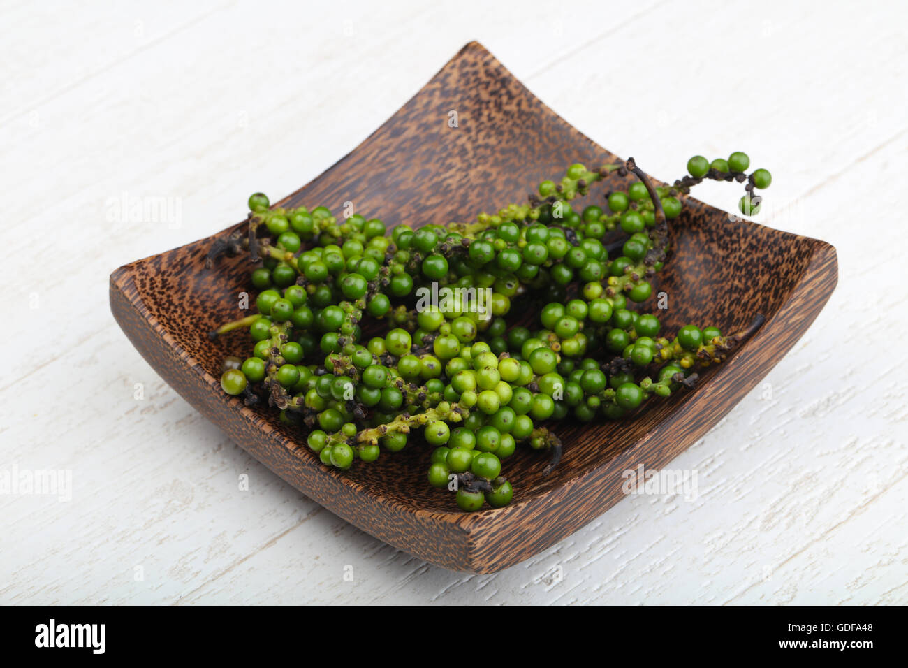 Green pepper corn on the branch in plate Stock Photo - Alamy